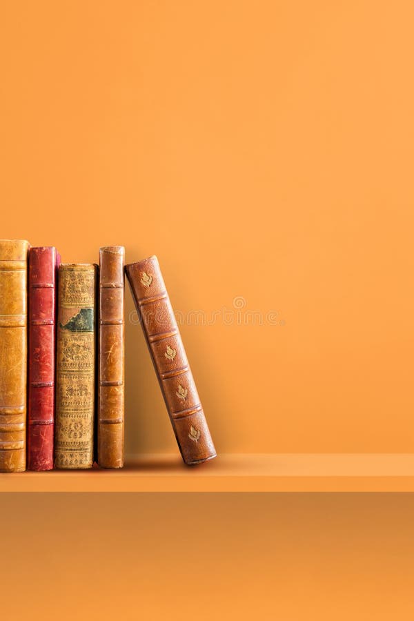 Row of Old Books on Orange Shelf. Vertical Background Stock Image ...