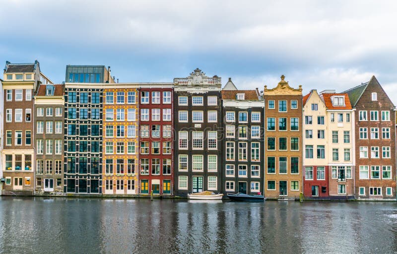 A Row of Old Traditional Houses in Amsterdam Stock Photo - Image of ...