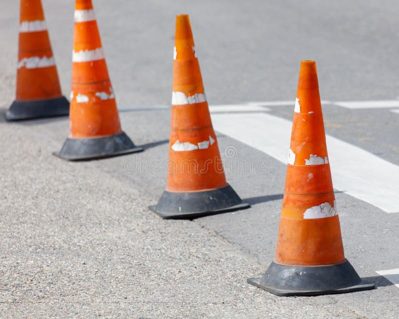 A Row of Orange Traffic Cones are Lined Up on a Road Stock Image ...