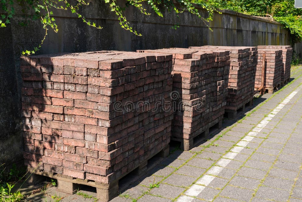 A Row of Pallets Stacked High with Bricks . Stock Image - Image of ...