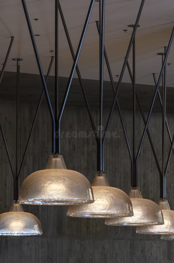 Row of Pendant Light Lamps Set in Modern Interior Stock Photo - Image ...