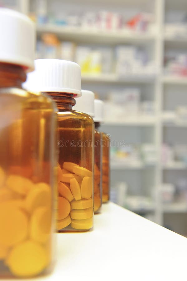Row of pill bottles stock image. Image of dispensary, pharmacy - 8551091