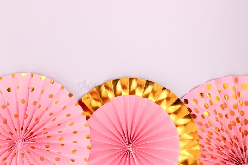 Row of Pink Paper Fans on a Blue Background. Stock Image - Image of ...