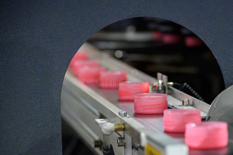 The Row of Pink Plastic Bottle Caps Ion the Conveyor Belt Stock Image ...