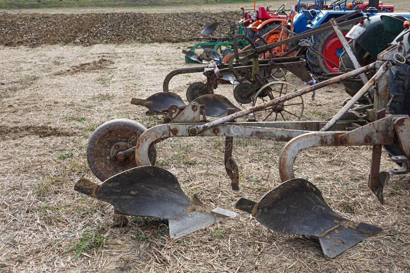 Row of Plow Agricultural Equipment Stock Image - Image of field ...