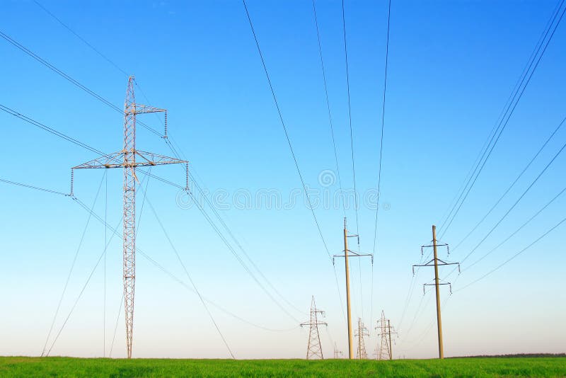 High Voltage Electricity Pylons Stock Photo - Image of yellow, poles ...