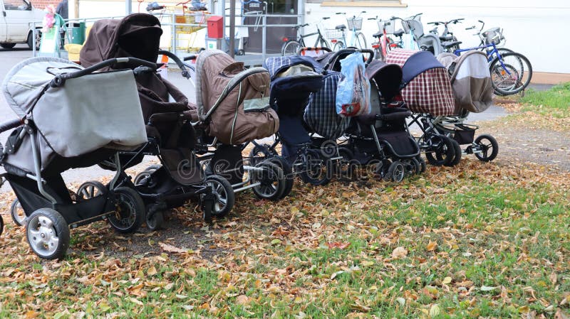 A Row of Prams Waiting for Children Stock Photo - Image of waiting ...