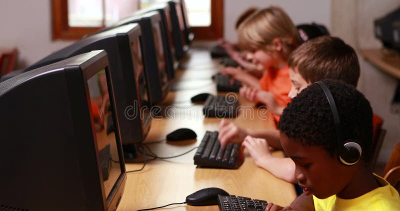 Row of Pupils Working in Computer Class Stock Video - Video of five ...