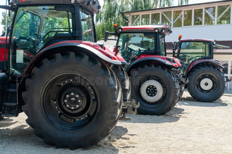 Row of Red Agricultural Tractors for Sale Stock Photo - Image of ...