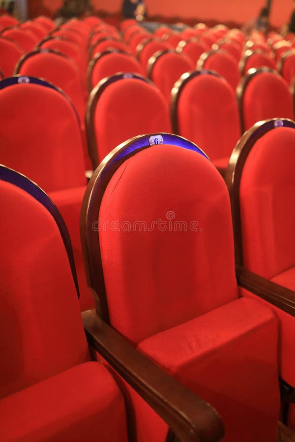 Row red chairs in cinema stock photo. Image of fabric - 142240554