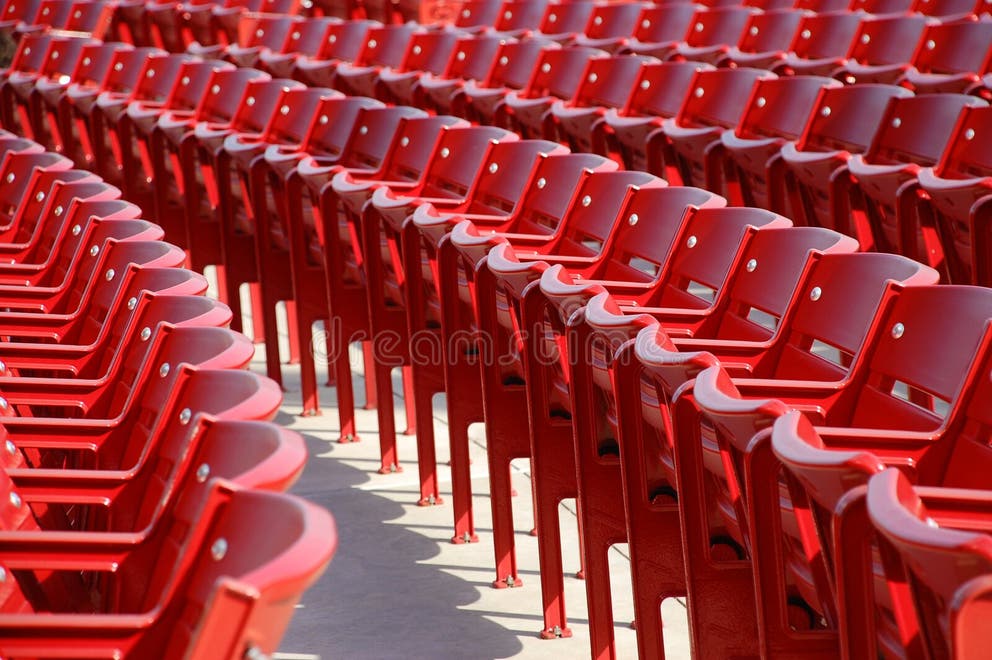 Row of red chairs rounded stock photo. Image of hall - 13070104