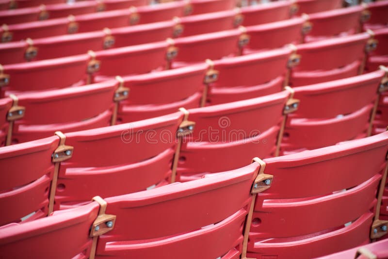 A Row of Red Seats with Wooden Handles Stock Photo - Image of number ...