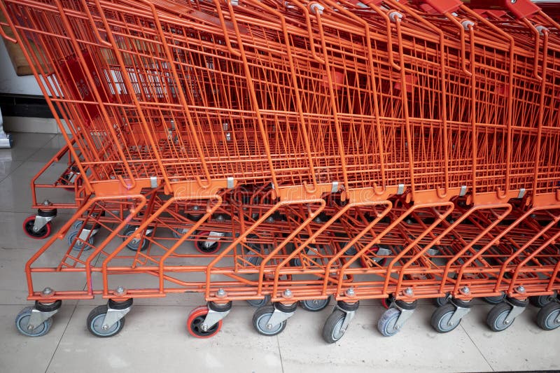 A Row of Red Shopping Carts in a Modern Supermarket Stock Image - Image ...