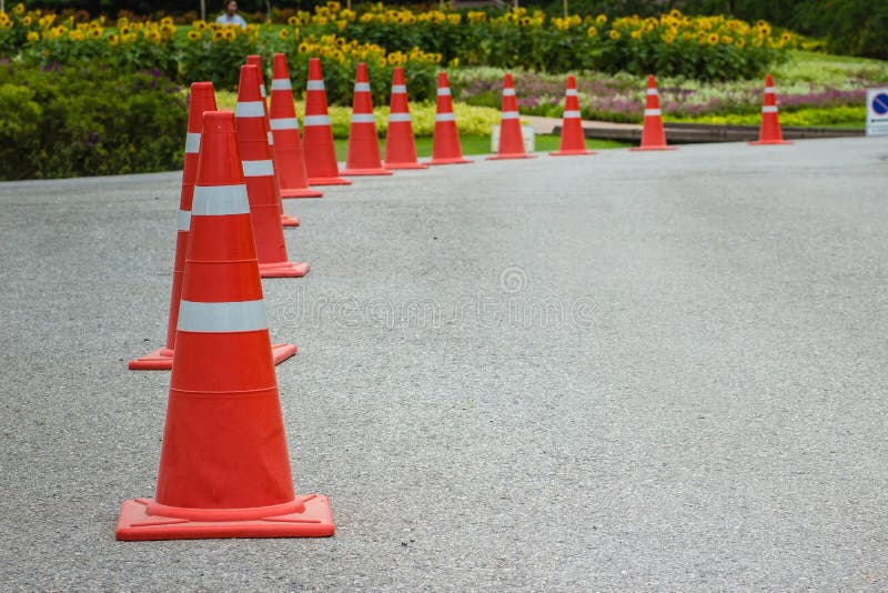 Row of Red Traffic Cones on the Asphalt Road Stock Image - Image of ...