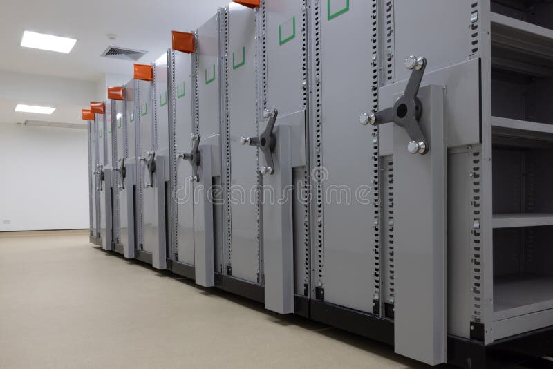 A Row of Revolving Metal Storage Shelves Stock Image - Image of office ...