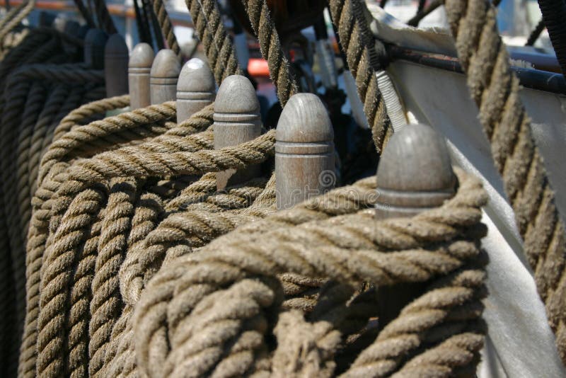Row Of Ropes Tied Around Wooden Cleats Picture. Image: 1434073