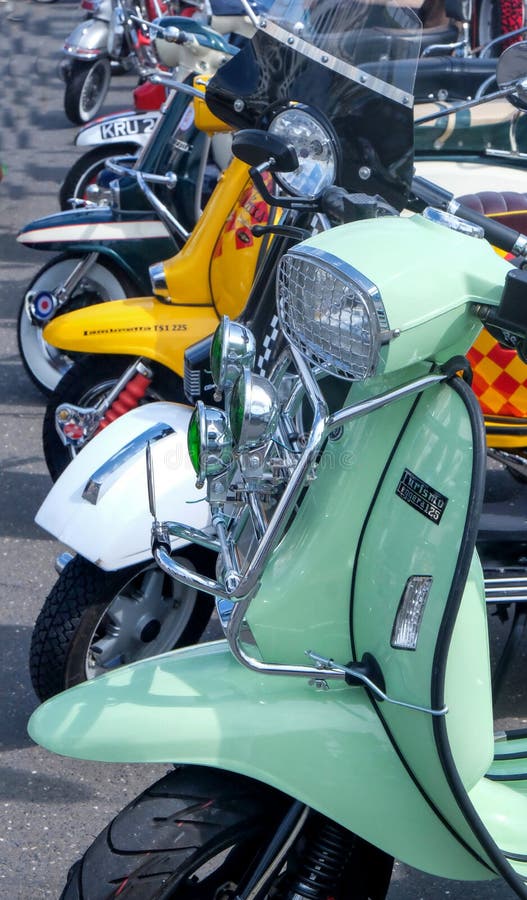 A Row of Seven Mopeds Front Wheels Editorial Stock Image - Image of ...