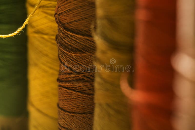 A Row of Sewing Thread Spools of Different Colors Stock Photo - Image ...
