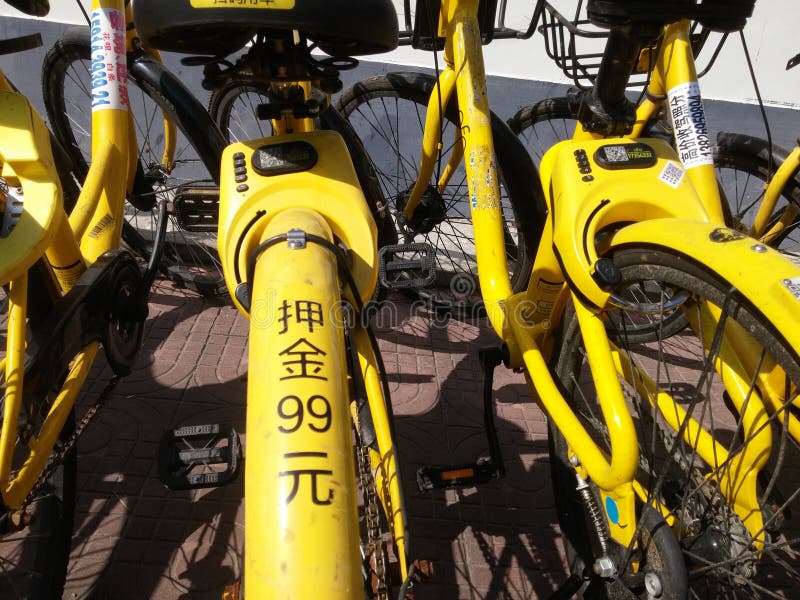 Shenzhen, China: a Row of Shared Bicycles Parked on the Sidewalk ... Shenzhen, China: a Row of Shared Bicycles Parked on the Sidewalk ...