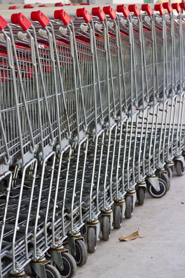 Row of shopping carts stock photo. Image of hypermarket - 35777910