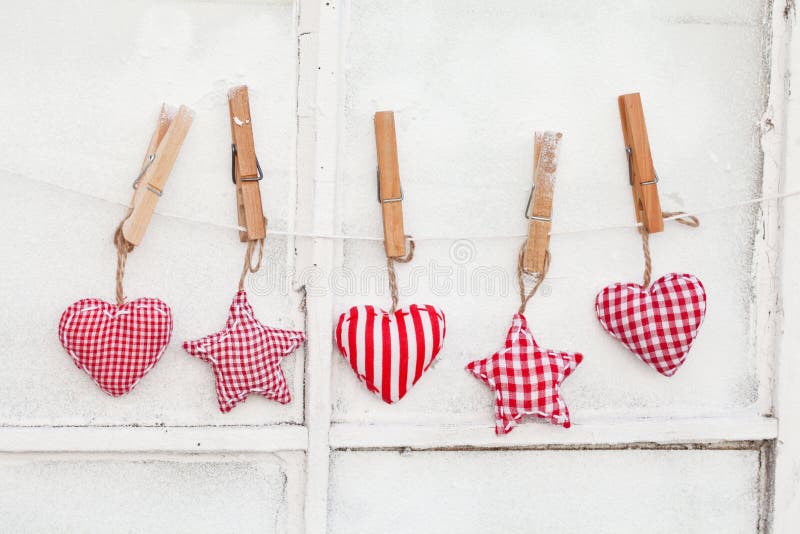 Row of Small Star and Heart-shaped Plush Toys Hanging from a String ...