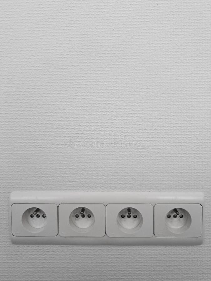 Row of Sockets on White Wall with Copy Space Vertical Shot Stock Image ...