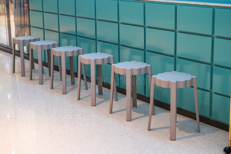 A Row of Stools Used in Queues Outside a Restaurant Stock Image - Image ...