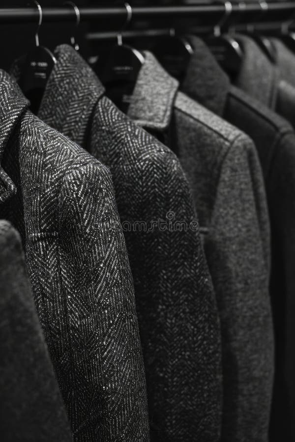 A Row of Suits Hanging on a Rack in a Store or Closet Stock Image ...