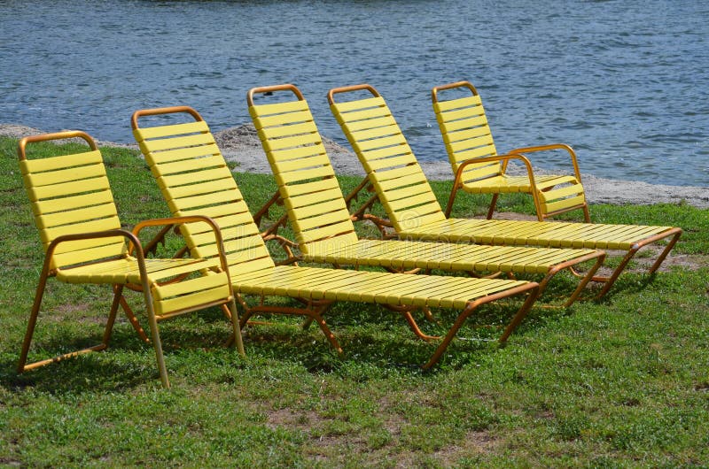 Row of Sun Loungers and Deck Chairs Stock Photo - Image of ocean ...