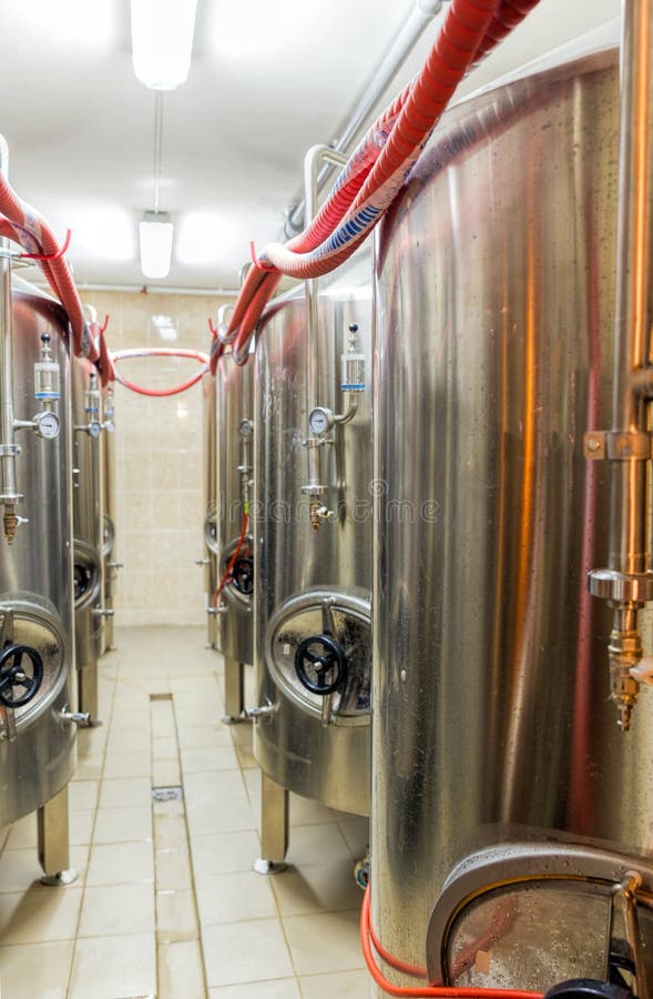 Row of tanks in brewery stock photo. Image of shiny - 187562682