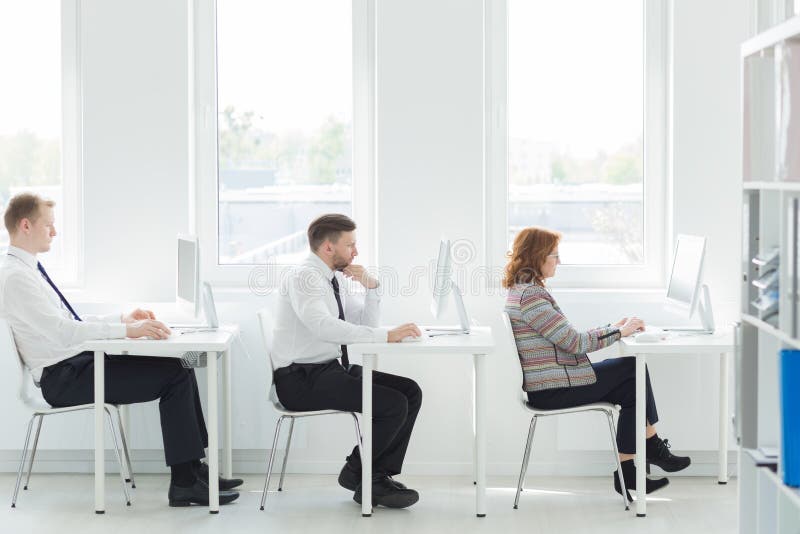 Row of telemarketers stock image. Image of office, corporation - 75689787