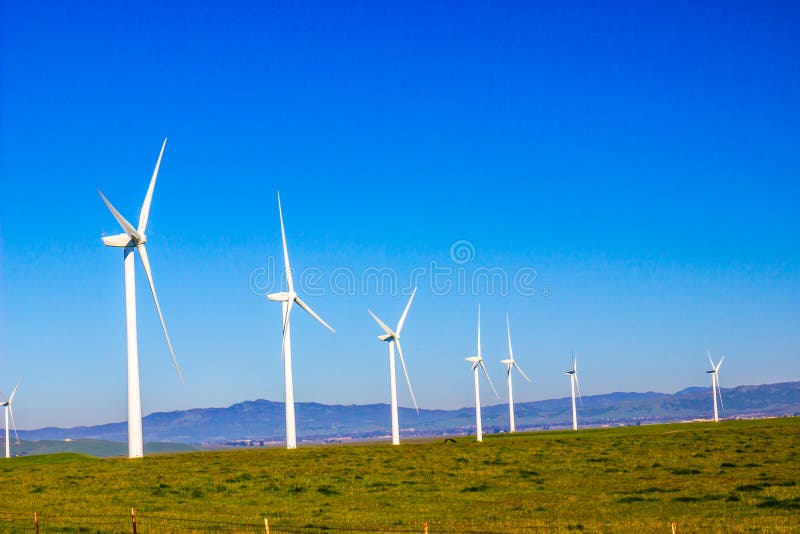 Row of Three Bladed Energy Producing Windmills Stock Image - Image of ...