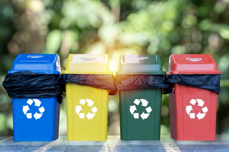A Row of Trash Cans are Lined Up in a Row, with Each One a Different ...