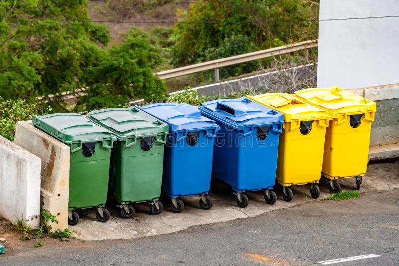 A Row of Trash Cans are Lined Up on the Side of the Road Stock Image ...