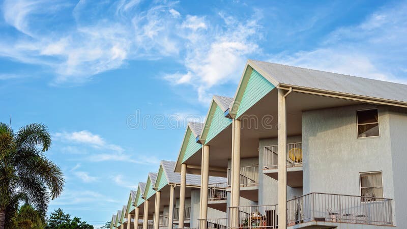 Row of Triangle Shaped Roofs Stock Photo - Image of balconies, concrete ...