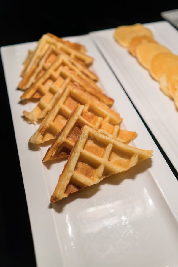 A Row of Triangle Waffles Arranged on Rectangle Platter Stock Image ...