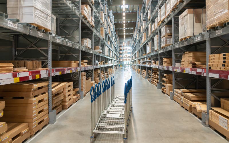 A Row of Trolleys for Customers in a Large Warehouse in the Aisle ...