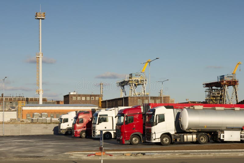 Row of Trucks in Front of Refinery Stock Image - Image of industry ...
