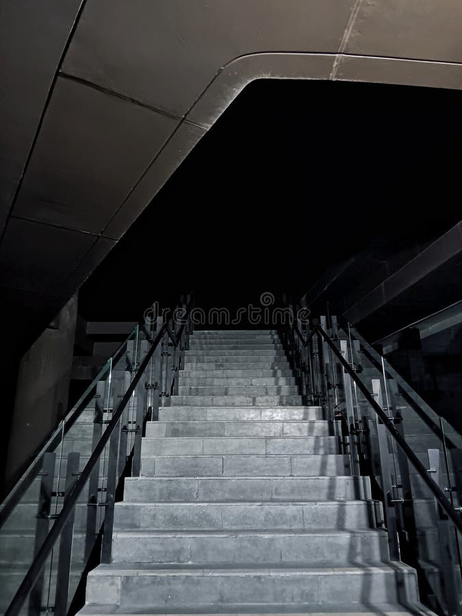 A Row of Unpainted Steps Looks Simple with Glass Partitions, Going Up ...