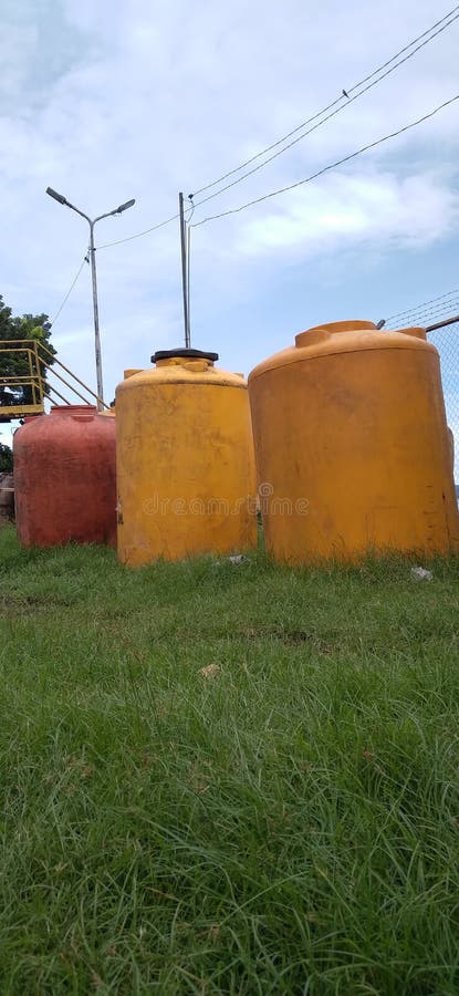 Row of used water tanks stock image. Image of wood, used - 266159729