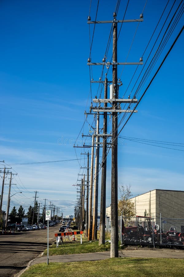 A Row of Utility Power Poles Stock Photo - Image of construction, road ...