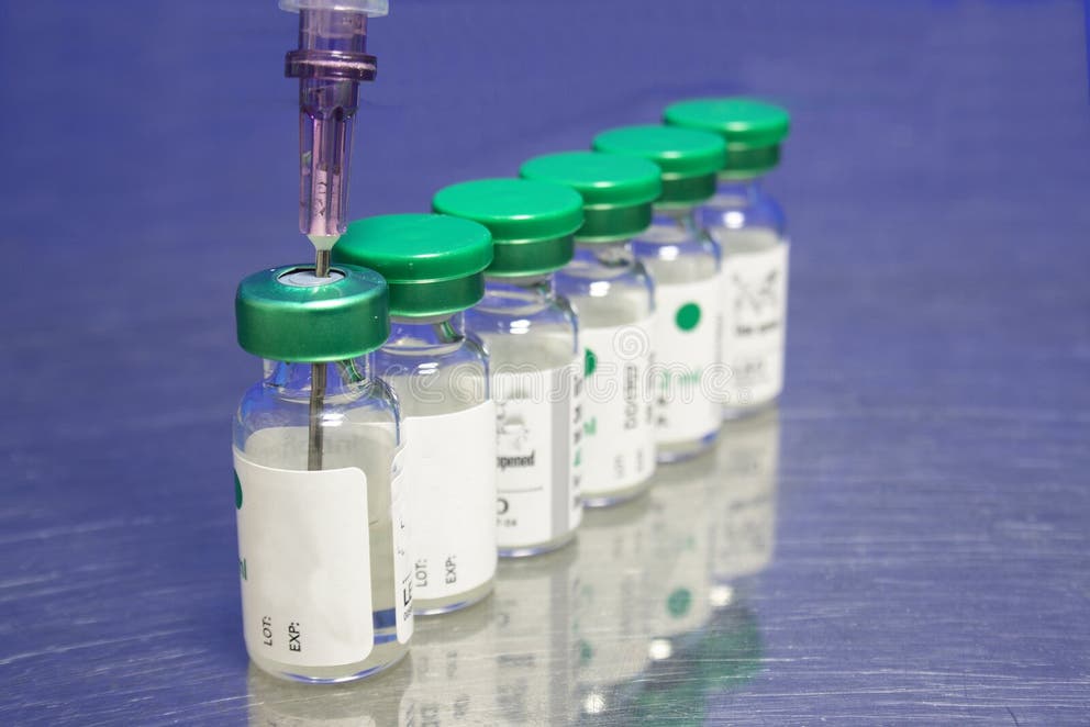 Row of vials and needle stock photo. Image of medical - 8576694