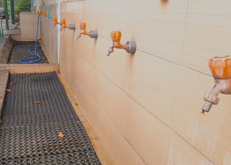 A Row of Water Faucets for Ablution (wudhu) Stock Photo - Image of ...