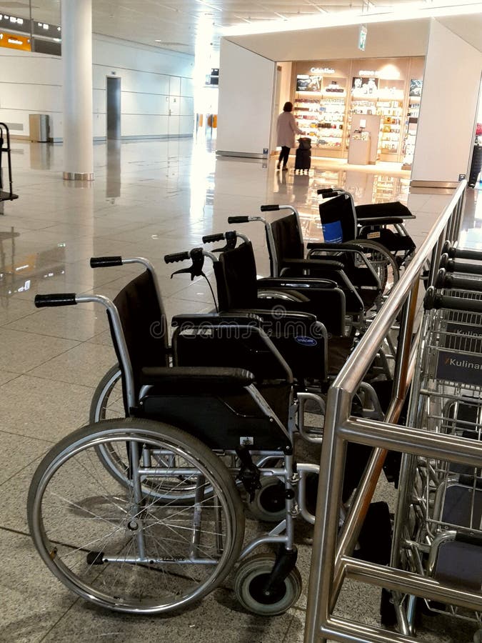 Row of wheelchairs stock image. Image of light, persons - 88591793