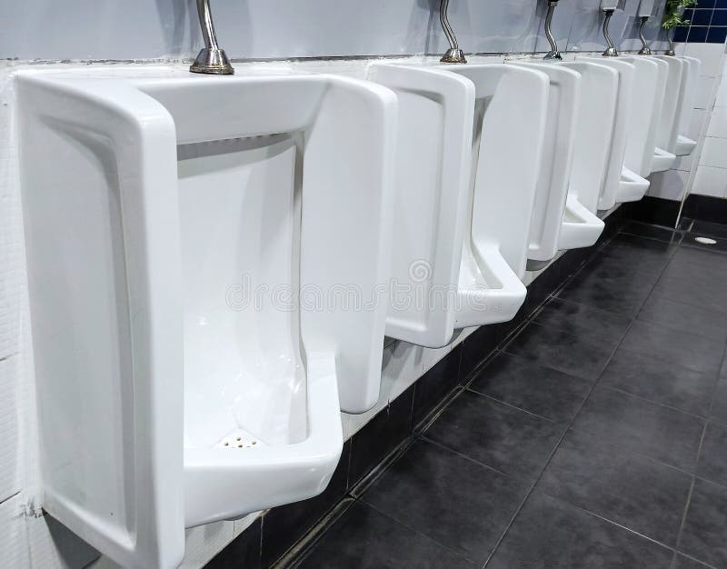 Row of White Urinals in a Public Restroom. Stock Image - Image of male ...