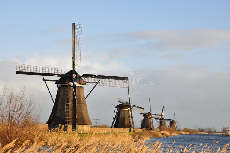 A row of Windmills stock image. Image of architecture - 84014151