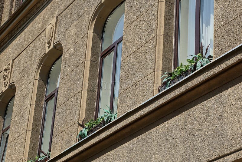 A Row of Windows on a Brown Stone Wall Stock Photo - Image of exterior ...