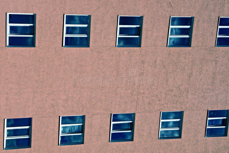 A Row of Windows on the Brown Wall of a Multi-storey Building Stock ...