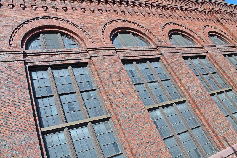 Row of Windows on a Red Brick Building Stock Image - Image of spokane ...