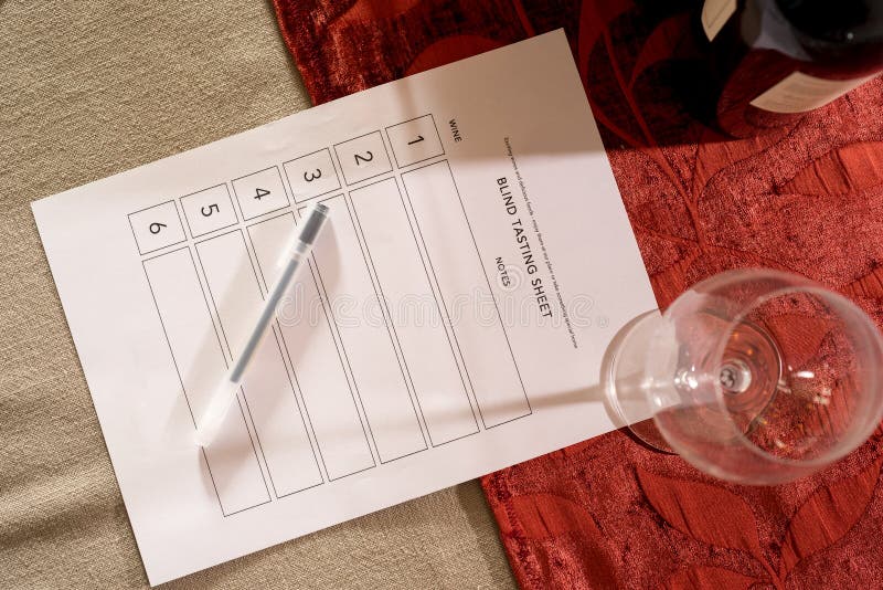 Row of Wine Bottles with Glasses and Tasting Forms Stock Photo - Image ...